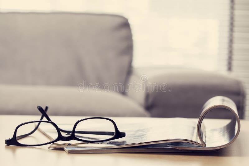 Reading Magazine in Living Room Stock Image - Image of news, read: 76236287