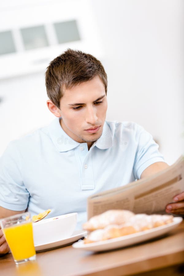 Reading Male Eats Healthy Breakfast in Kitchen Stock Photo - Image of ...