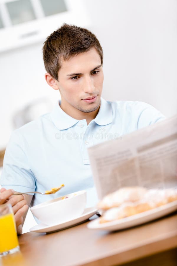 Reading Man Eats Tasty Breakfast in Kitchen Stock Image - Image of ...