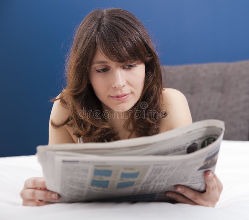 Reading the newspaper stock photo. Image of information - 18878478