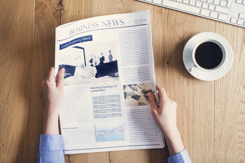 Reading newspaper on desk stock image. Image of read - 93991759