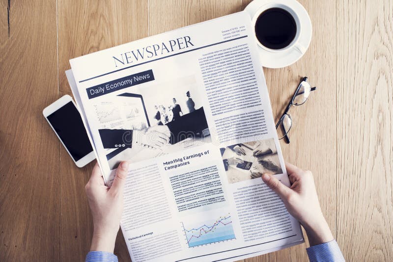 Reading newspaper on desk stock image. Image of table - 93994683