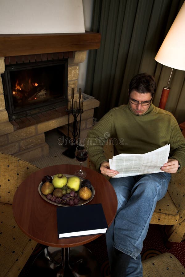 Reading newspaper at home stock photo. Image of home, recreation - 1716638