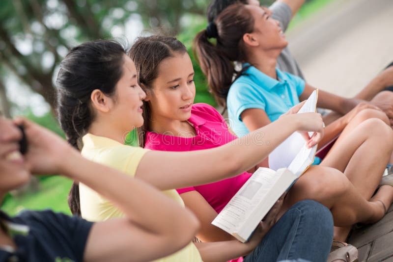 Reading outside stock image. Image of focus, people, holding - 34063669