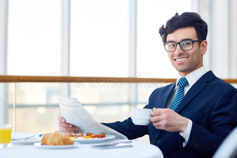 Reading paper by breakfast stock image. Image of banker - 92350289