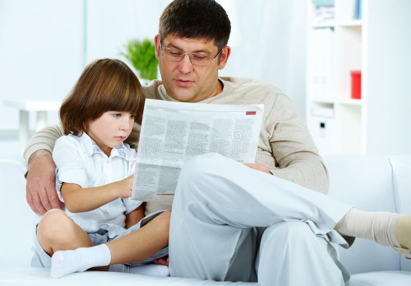 Reading paper together stock photo. Image of person, adorable - 24054708