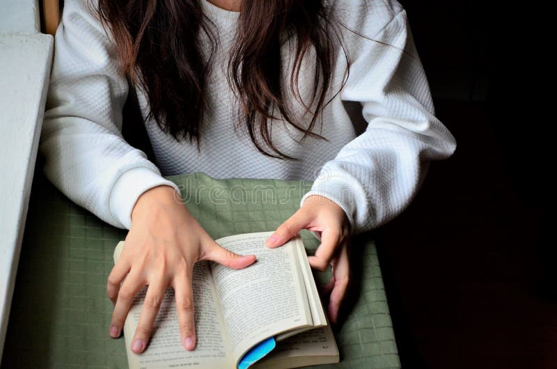 Reading a pocket book stock photo. Image of open, learning - 66813932