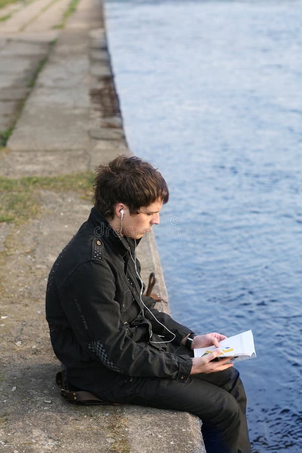 Reading by the river stock image. Image of nature, clothing - 9167541