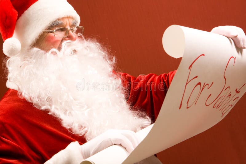 Santa reading a book stock photo. Image of eyeglasses - 17230002