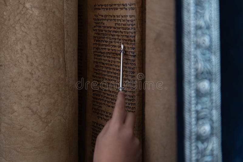 Reading a Sephardi Torah Scroll Using a Small Silver Pointer Stock ...