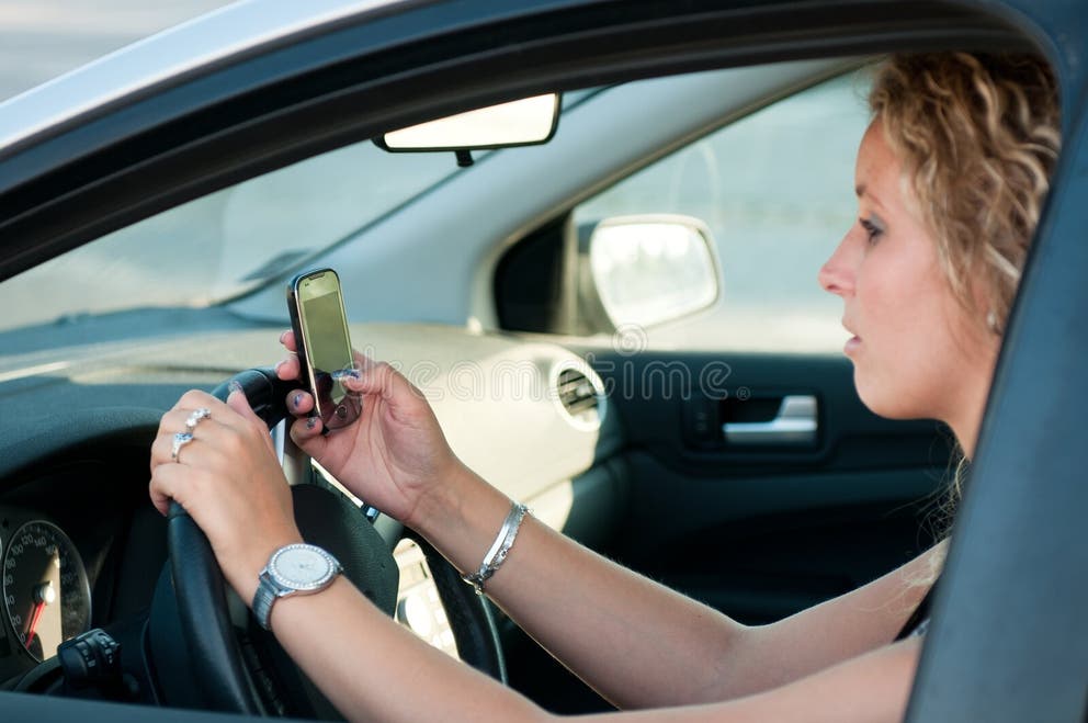 Reading SMS while Driving Car Stock Image - Image of cellphone ...