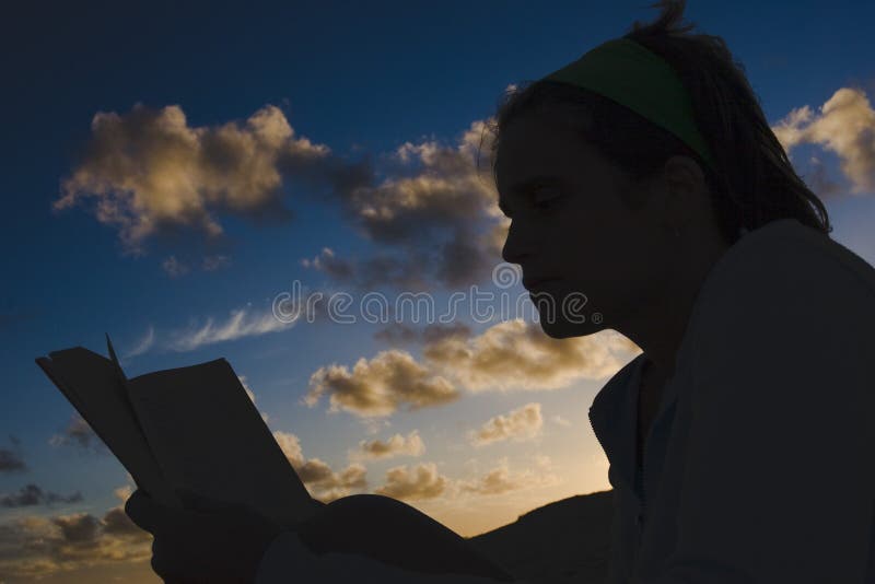 Man reading in the sunset stock image. Image of silhouette - 8616031