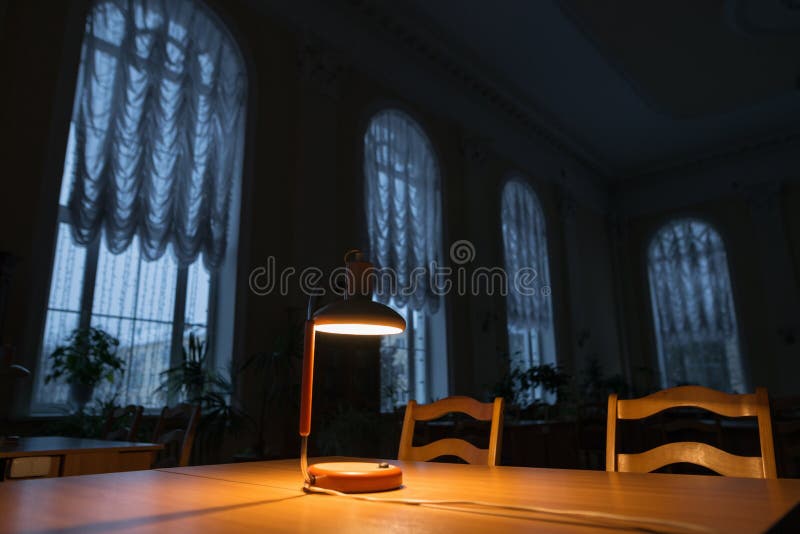 Reading at the Table with a Lamp in the Library Stock Image - Image of ...