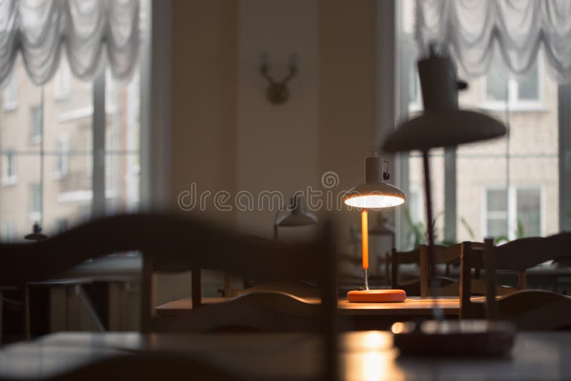 Reading at the Table with a Lamp in the Library Stock Image - Image of ...