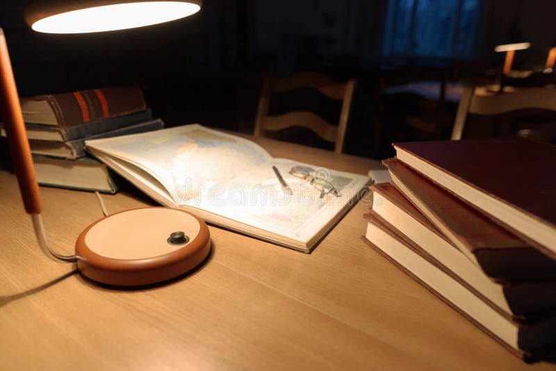 Reading at the Table with a Lamp in the Library Stock Photo - Image of ...