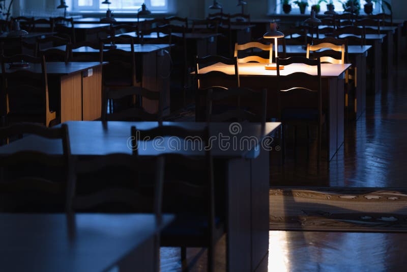 Reading at the Table with a Lamp in the Library Stock Image - Image of ...