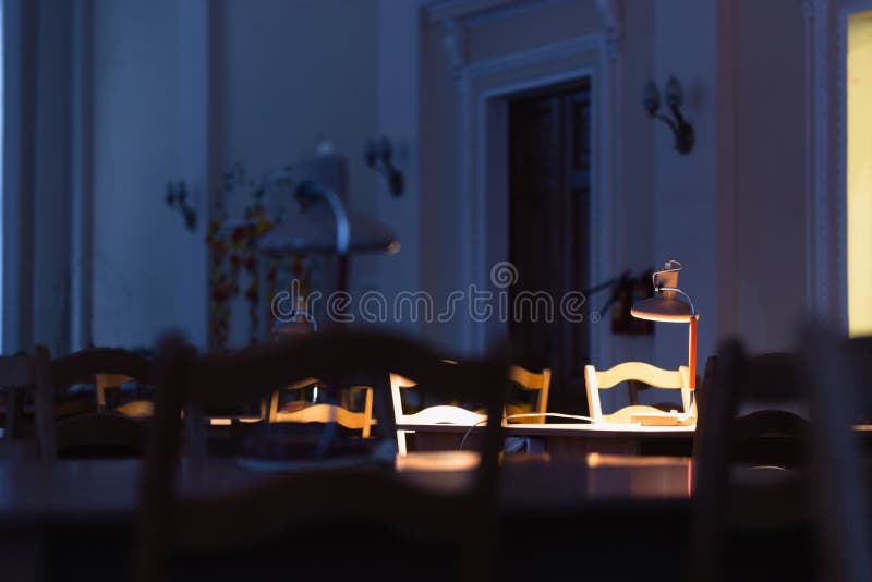 Reading at the Table with a Lamp in the Library Stock Image - Image of ...