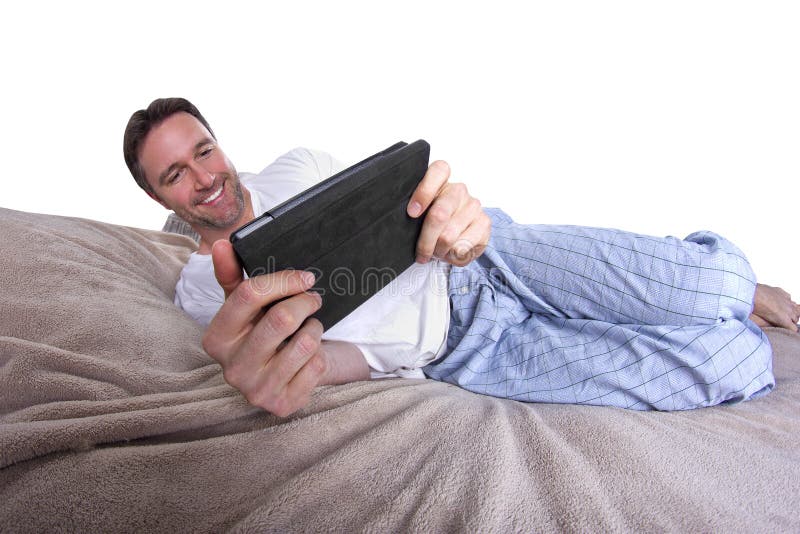 Reading Tablet in Bed stock photo. Image of online, lifestyle - 40877546