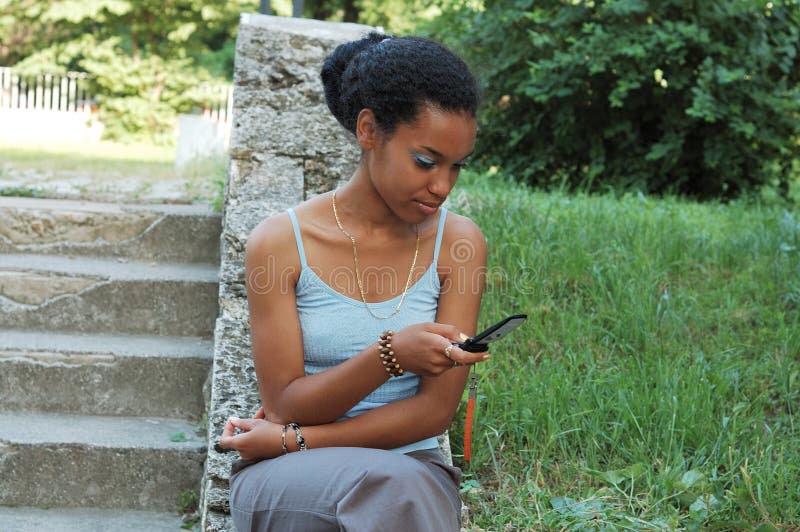 Reading text message stock photo. Image of black, happy - 5430384