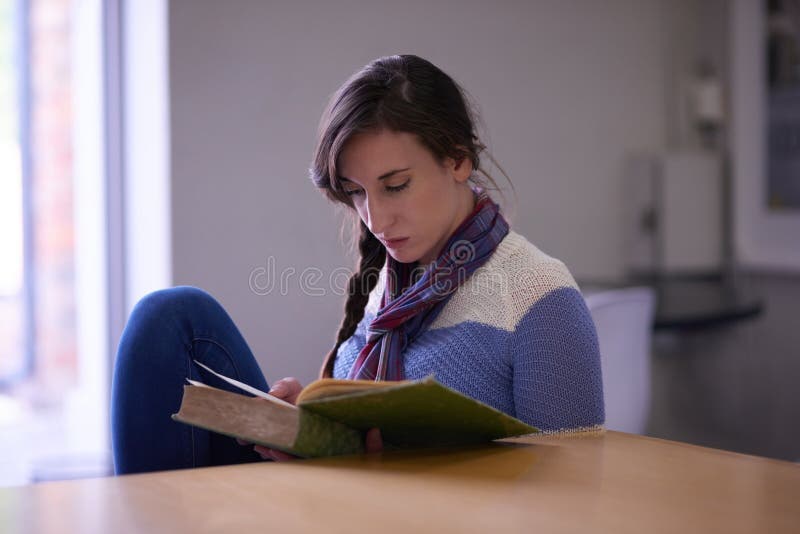 Reading Up on Some Notes for Her Next Class. a University Student ...