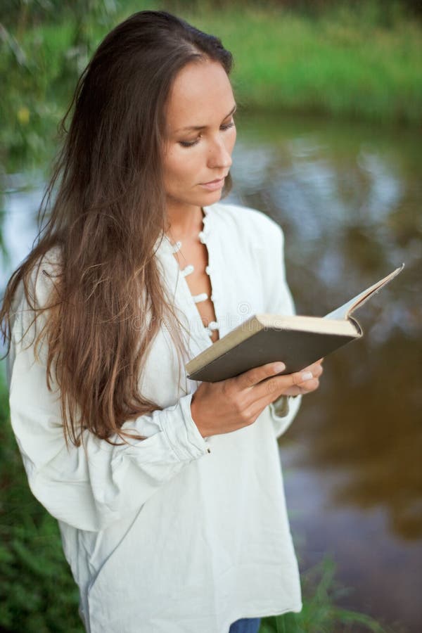 Reading Young Woman Near the River Stock Image - Image of happiness ...