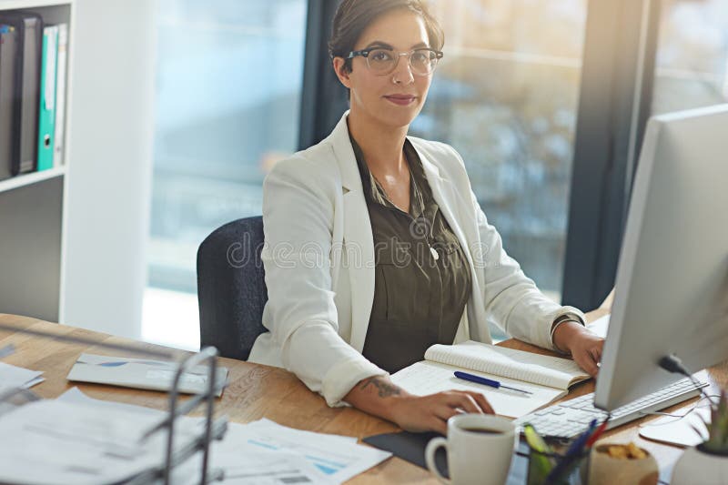 Always Ready for Any Challenge. Portrait of a Businesswoman Working on ...