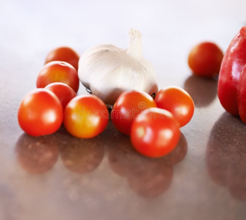 Ready for Chopping. a Cropped Shot of Garlic and Tomatoes on a Kitchen ...