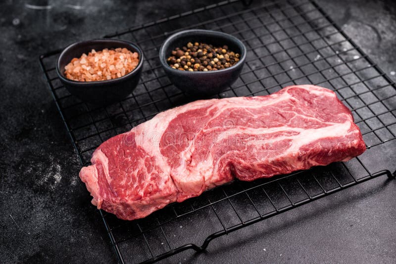 Ready for Cooking Chuck Eye Roll Steak, Fresh Raw Beef Meat on a Rack ...