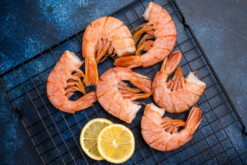 Ready for Cooking Headless Red Shrimps, Raw Prawns on a Rack. Blue ...