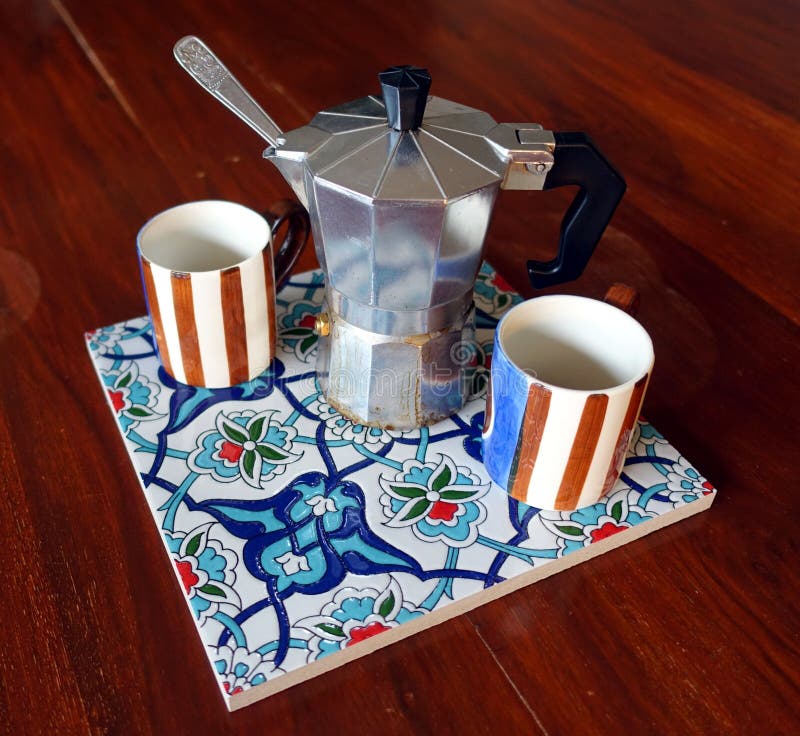 A Ready-made Mocha Coffee Machine with Two Full Cups Resting on a ...