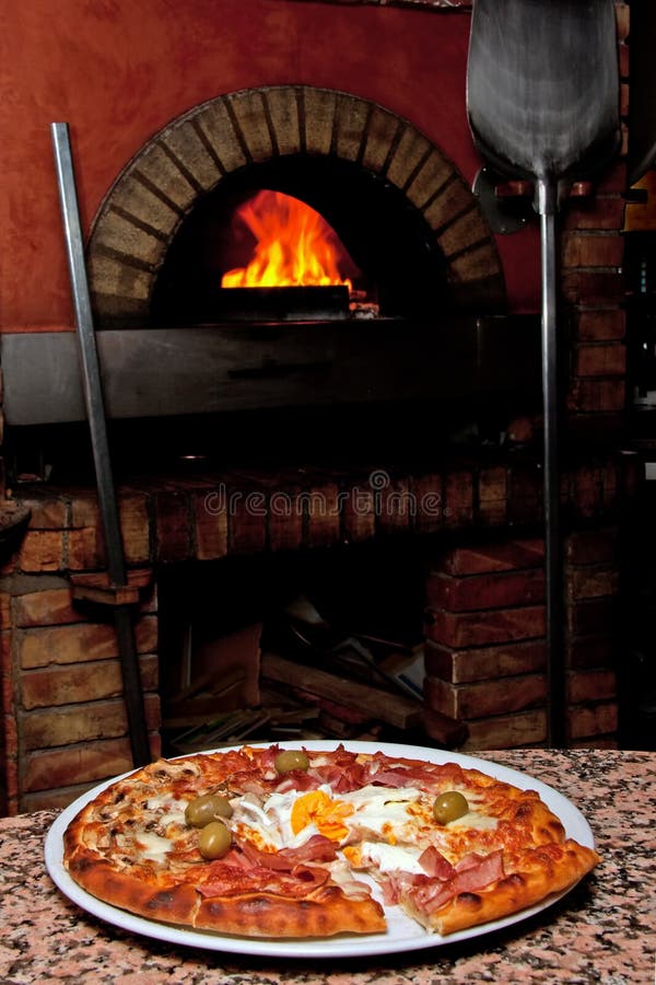 Italian Pizza in a Wood Burning Oven Stock Image - Image of dough ...