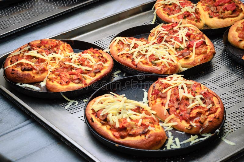 Mini Pizzas on Baking Tray stock photo. Image of pizzas - 138258340