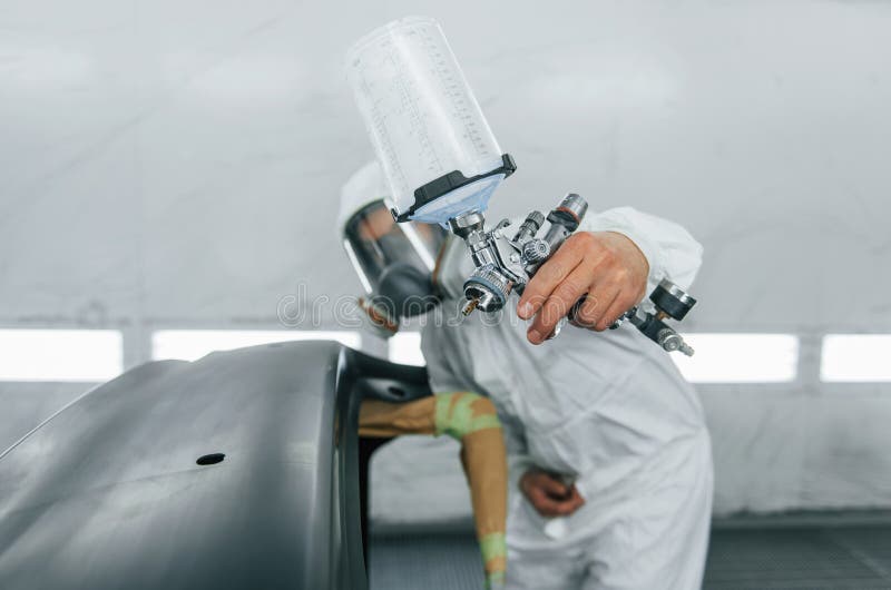 Ready for the Painting. Man in Uniform is Working in the Auto Service ...