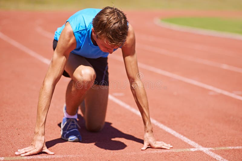 Ready for the Race. a Young Male Athlete at the Start of a Track Race ...