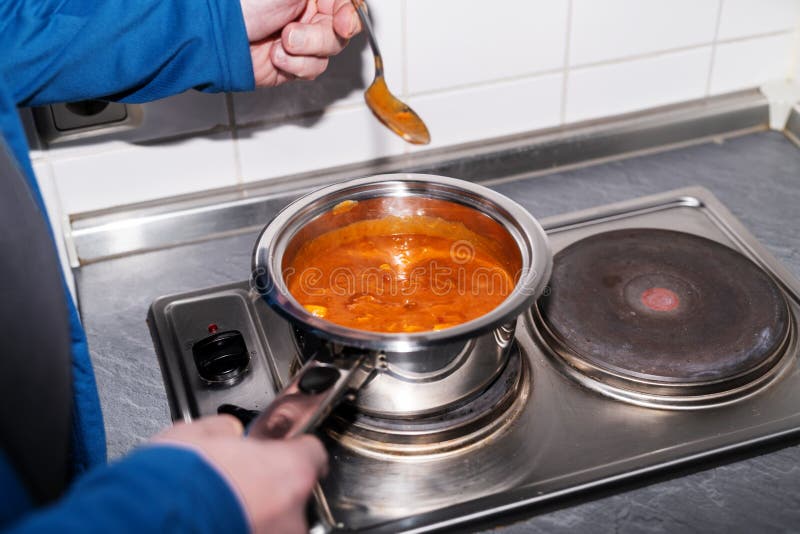 A ready soup is warmed up stock image. Image of eating - 208086803