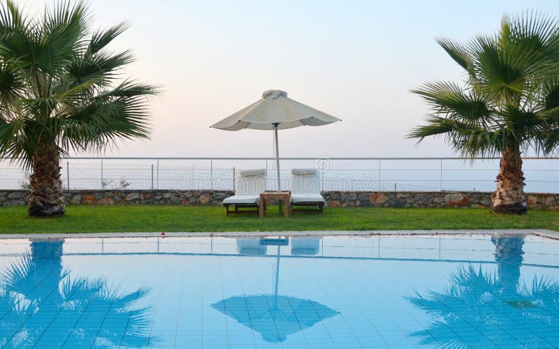 Ready for Summer: Sunbeds by the Pool Stock Photo - Image of sunbed ...