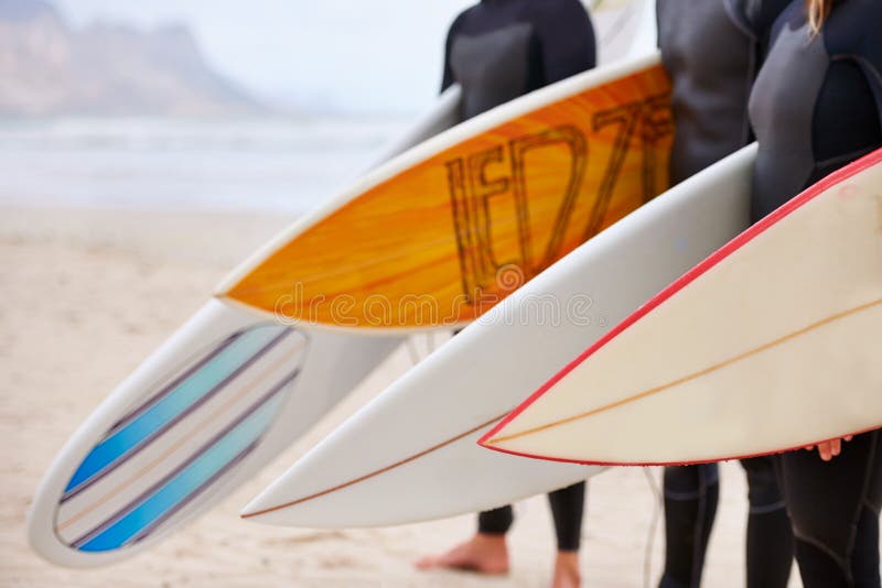 Ready To Catch the Next Wave. a Young Couple Out at the Beach with ...