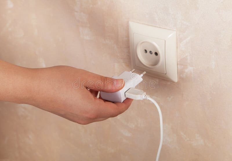 Ready To Connect. Plugging Electrical, Plug in Electric Socket on Wall ...