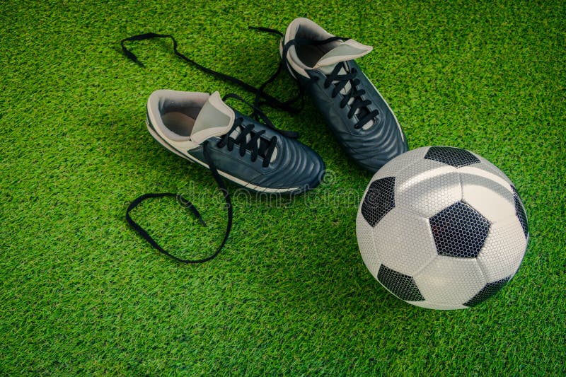 Ready for Victory: Boots and Ball on the Pitch Stock Image - Image of ...