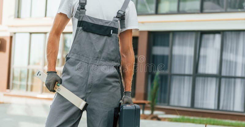 Ready for Work. Young Man in Uniform at Construction at Daytime Stock ...