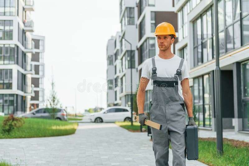 Ready for Work. Young Man in Uniform at Construction at Daytime Stock ...