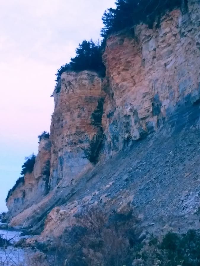 A real cliff hanger stock image. Image of cliff, ocean - 231006205