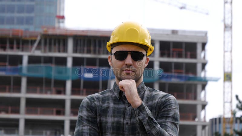 Real Construction Worker in Sunglasses Standing at Construction Site ...