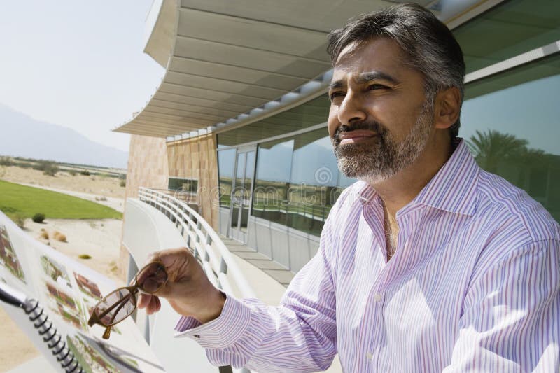 Real Estate Agent with Building Models Stock Photo - Image of ...