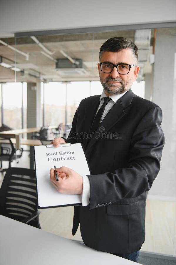 Real Estate Agent Explaining Contract Stock Photo - Image of office ...