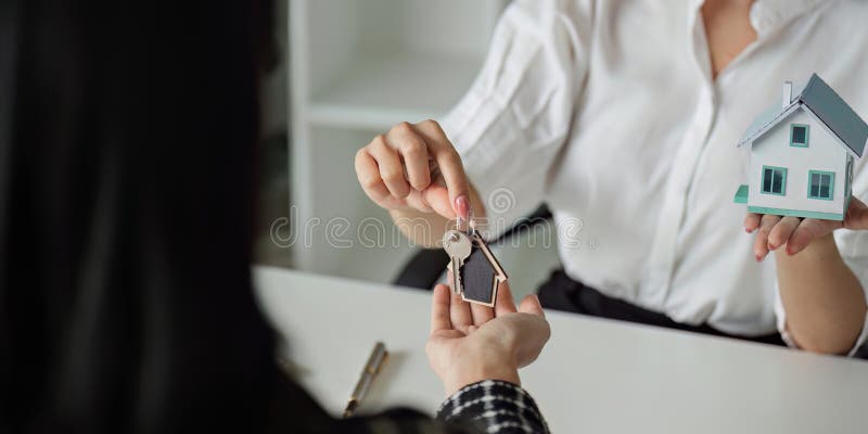 Real Estate Agent Give House Key To Client after Successfully Signing ...