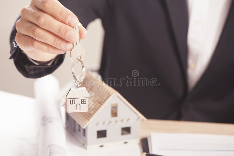 Real Estate Agent Handing Over House Keys. Stock Image - Image of ...