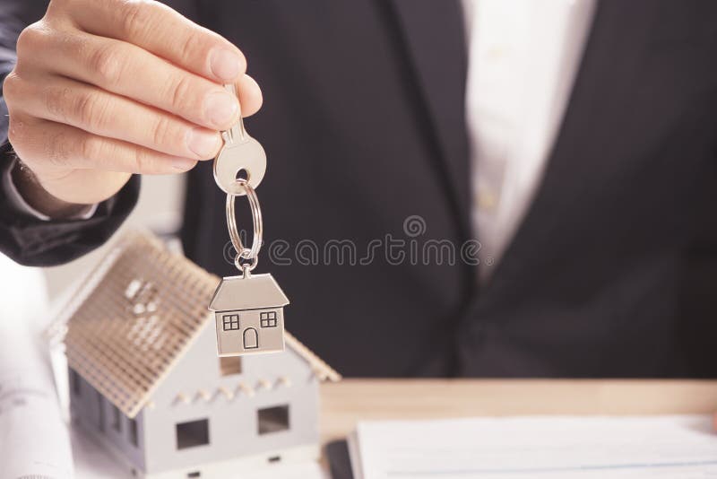 Real Estate Agent Handing Over House Keys. Stock Photo - Image of ...