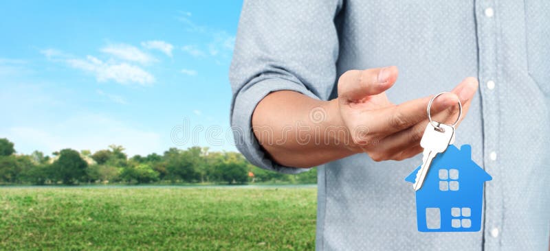 Real Estate Agent Handing Over House Keys in Hand Stock Photo - Image ...