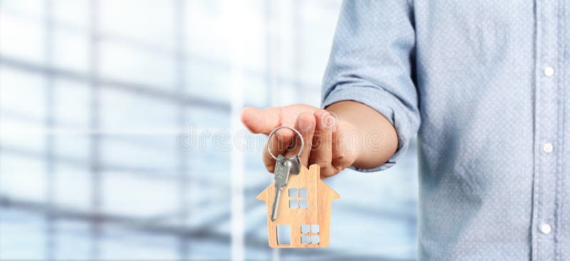 Real Estate Agent Handing Over House Keys in Hand Stock Photo - Image ...